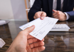 The Check is Torn – Now What? A Guide to Cashing Damaged Checks